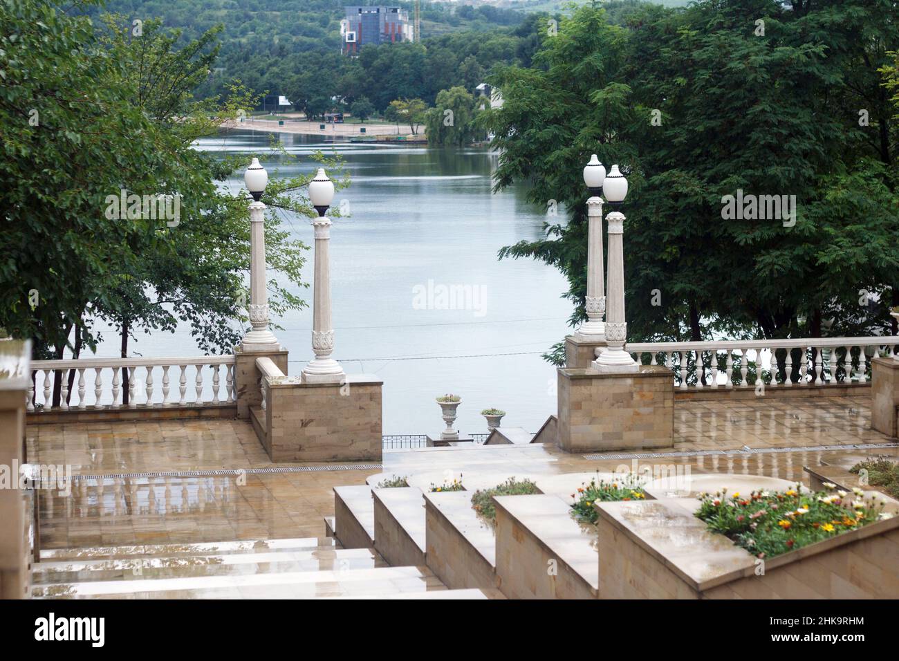 Panorama of modern park with beautiful concrete white columns, lamps ...