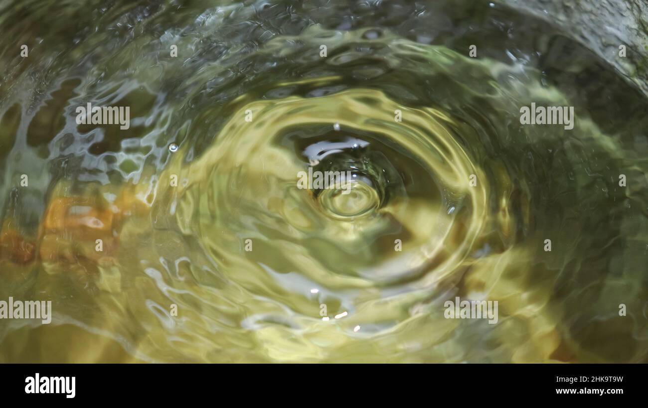 Circular dim water. Pure water vibration. With a background of water ...