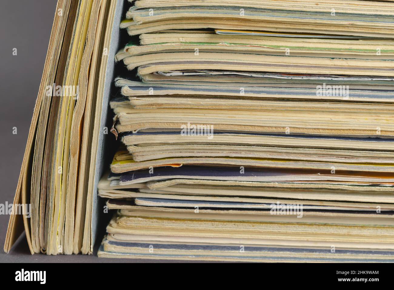 Collection of old comics and magazines against a gray background. Lots ...