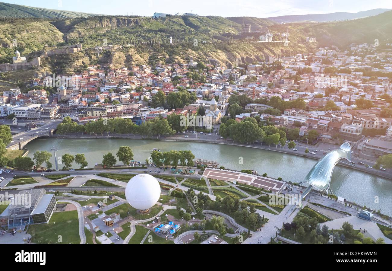 Old part of Tbilisi town with park aerial drone view on sunset time ...