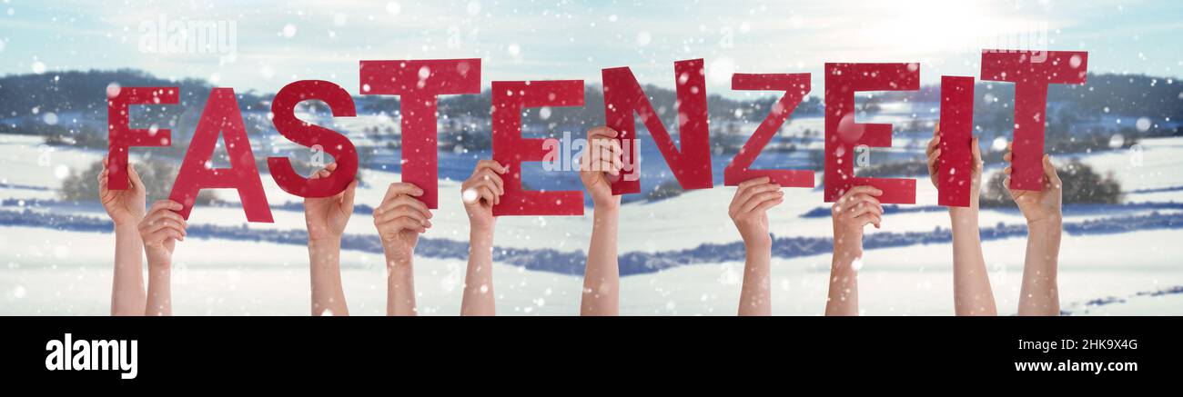 People Hands Holding Red German Word Fastenzeit Means Fasting. Snowy ...