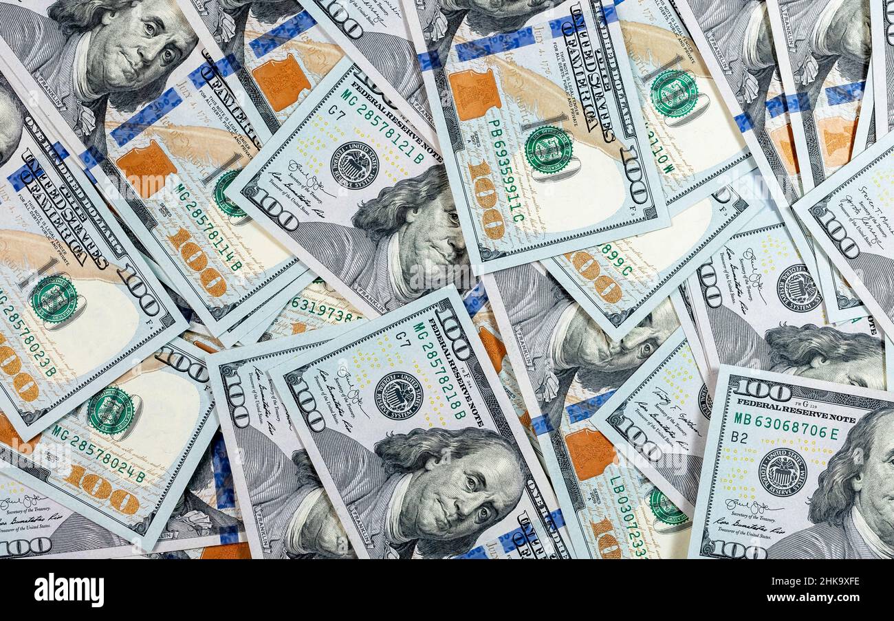 One hundred dollar bills background. American dollars heap. Concept of ...