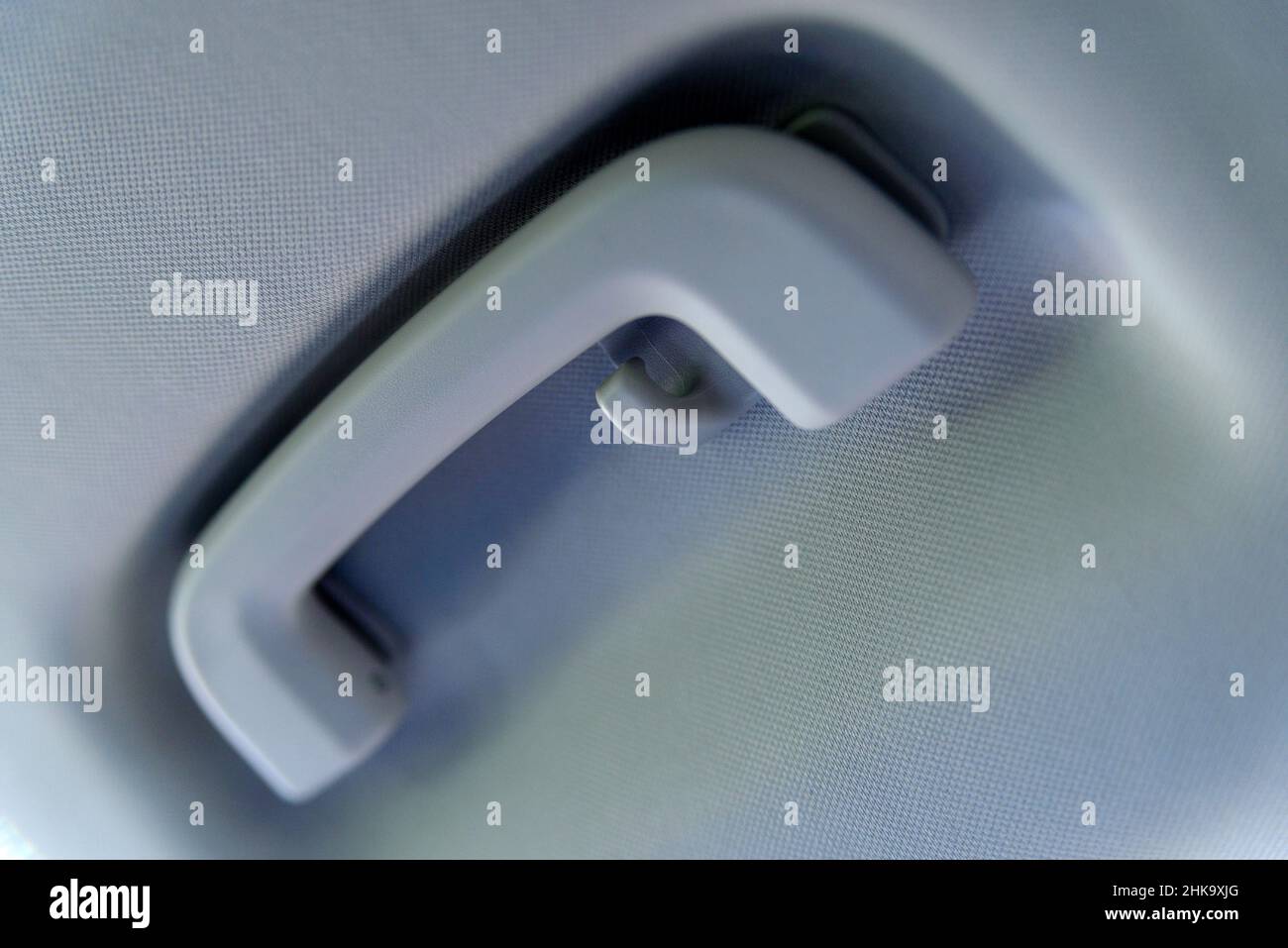 Overhead grab handle in car, showing handle and coat hook Stock Photo ...