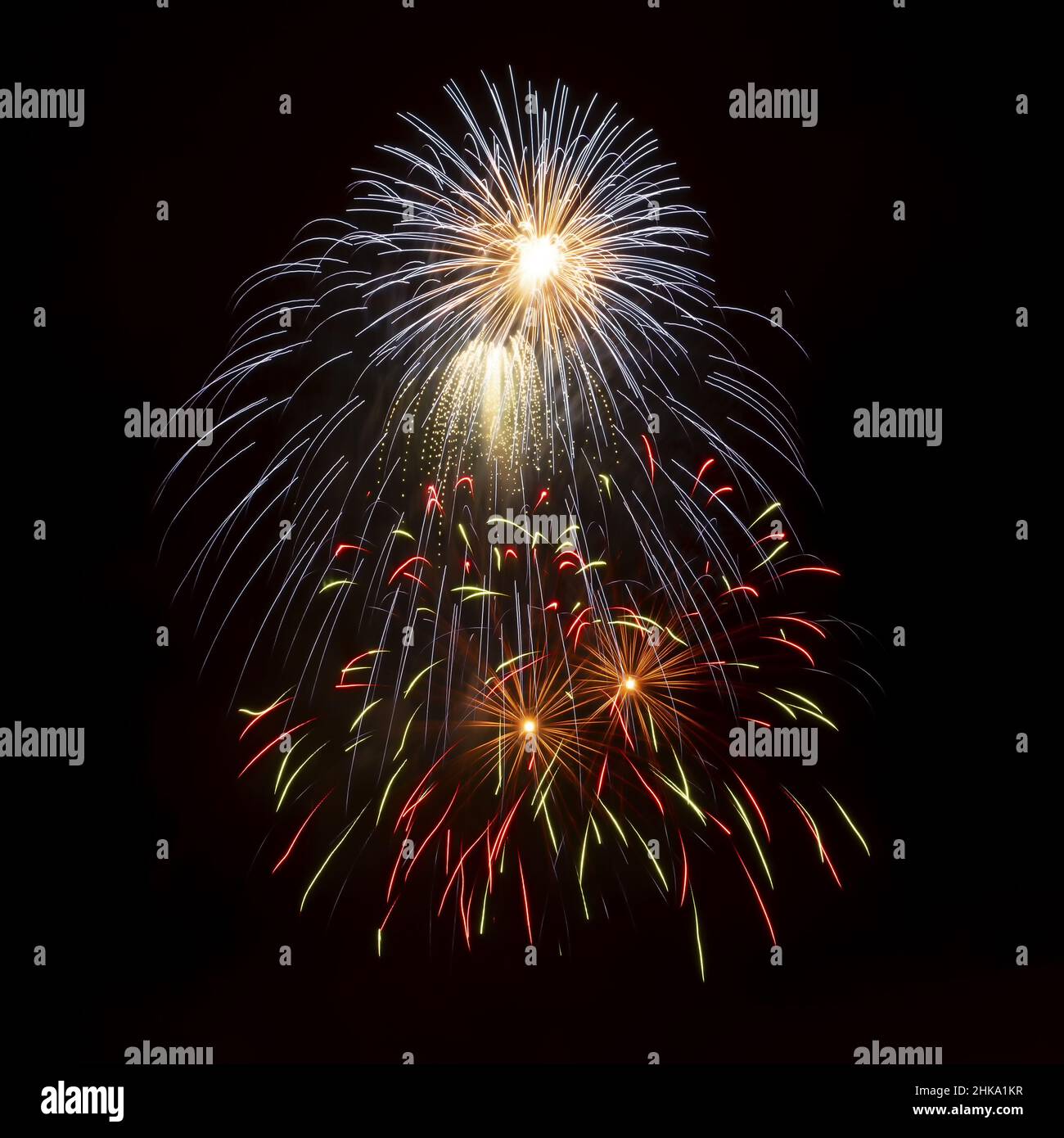 Beautiful fiery rays of light from explosion of pyrotechnics on black ...