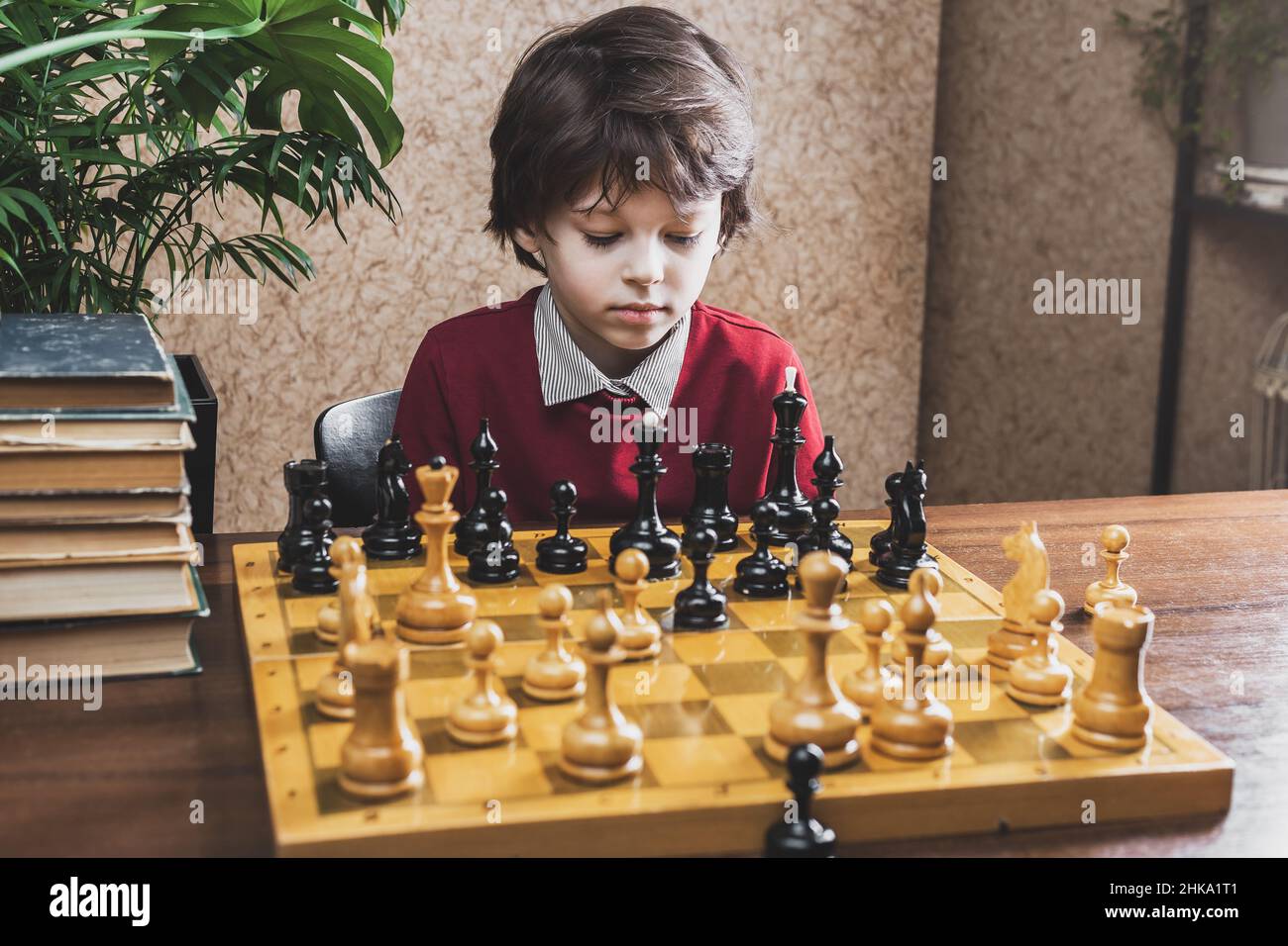 Learning to play a strategic game of chess hi-res stock photography and ...