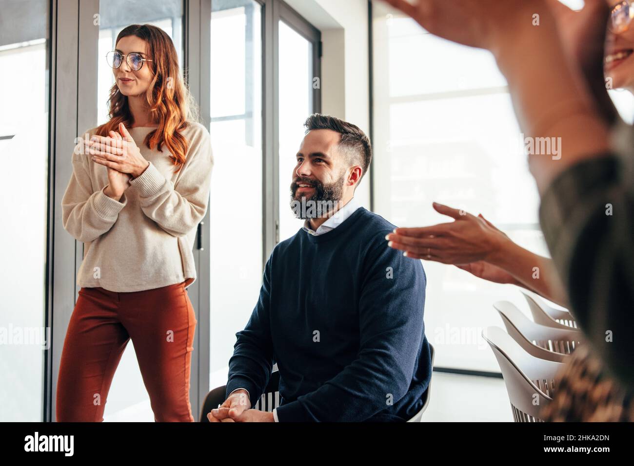 Woman clapping happily in modern hi-res stock photography and images ...