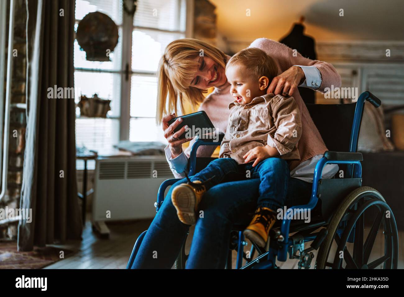 Child in wheelchair hi-res stock photography and images - Alamy