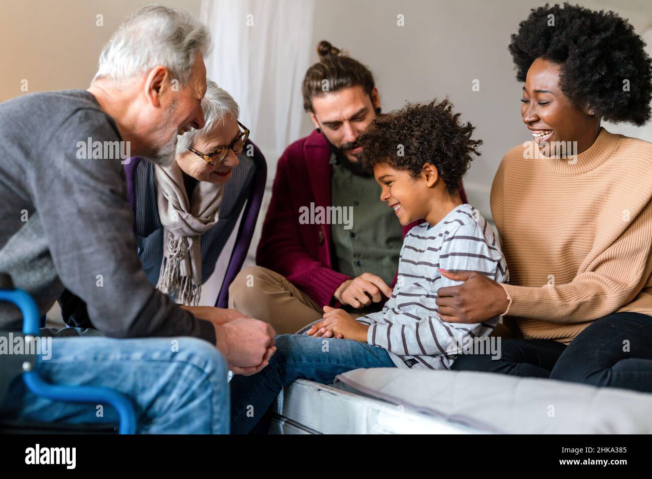 Portrait of multiethnic happy multi-generation family spending time ...