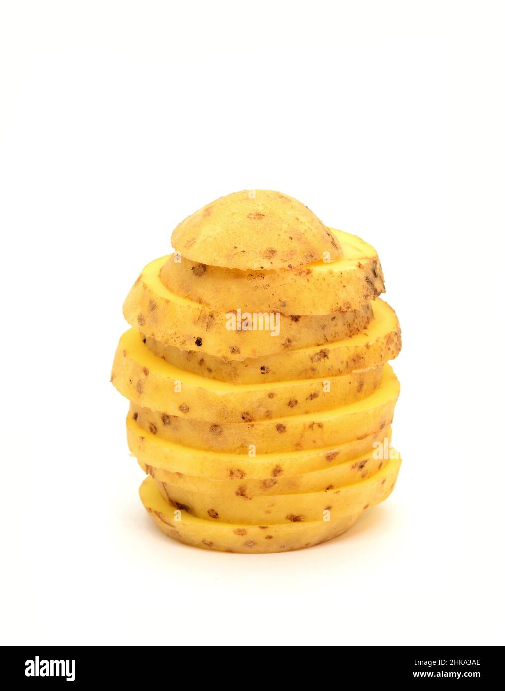 A stack made from sliced raw ripe potato on white background Stock ...