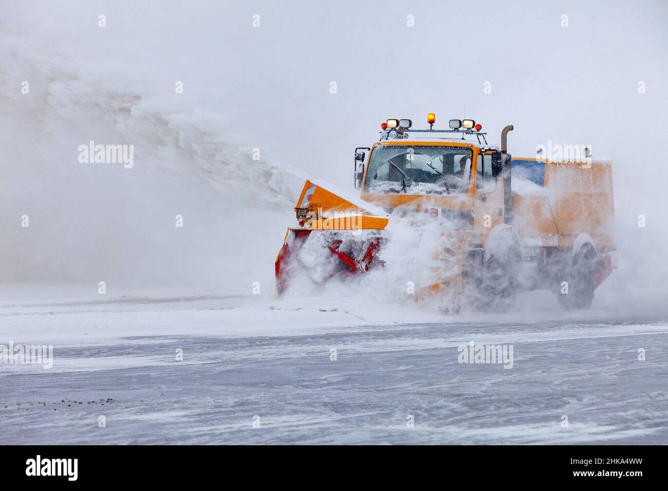 Snow plow is cleaning on the runway in after heavy snowstorm Stock ...