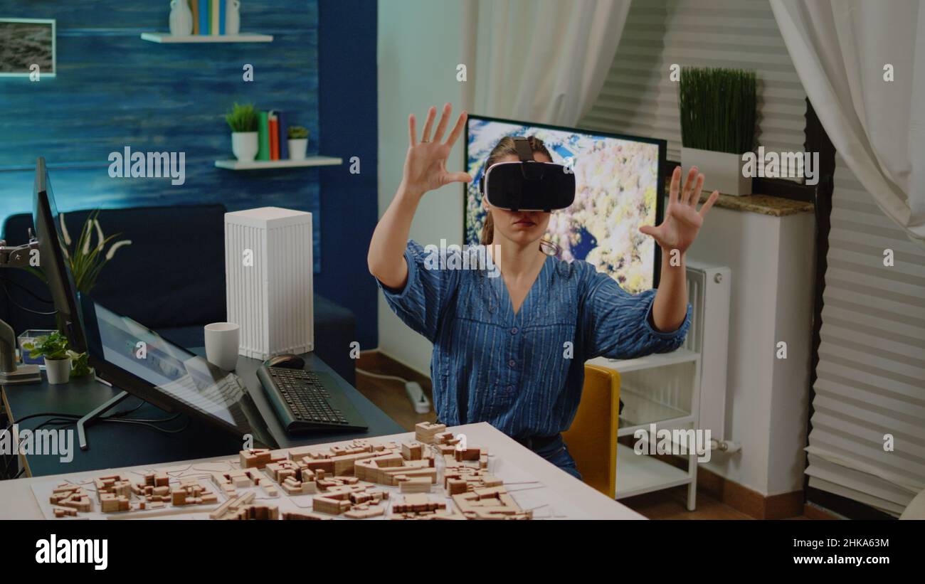 Architect using vr glasses for building design with blueprint plan on ...