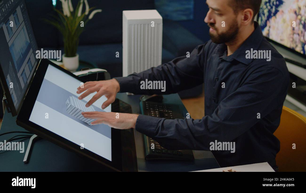 Close up of engineer using computer for building model and construction ...