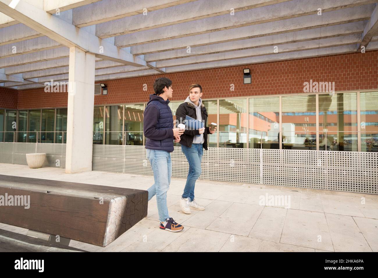 Two boys walking together school hi-res stock photography and images ...
