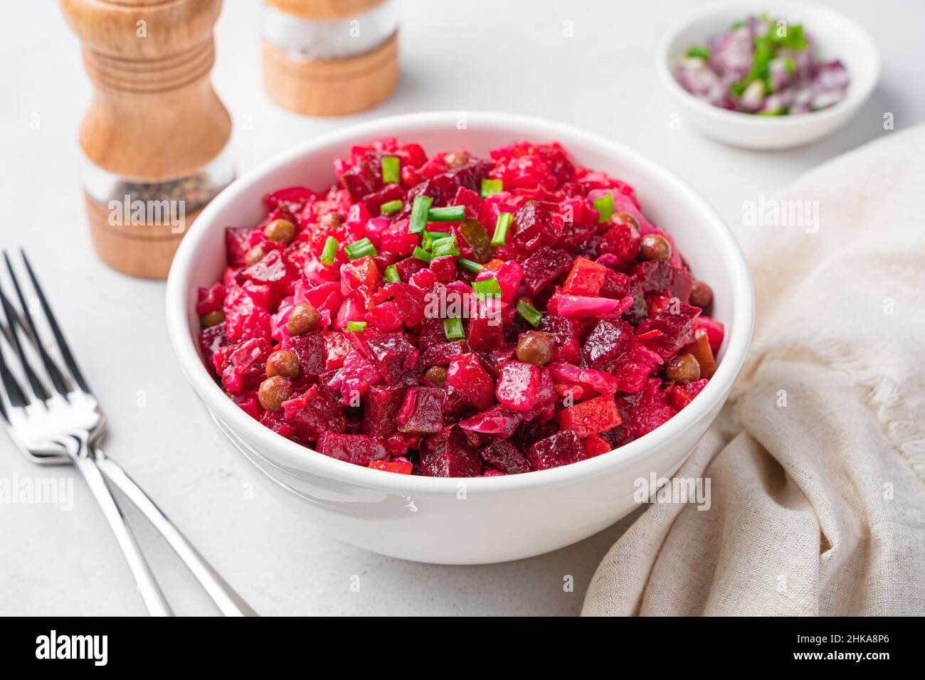 Beetroot salad, vinaigrette with vegetables close-up on a gray ...