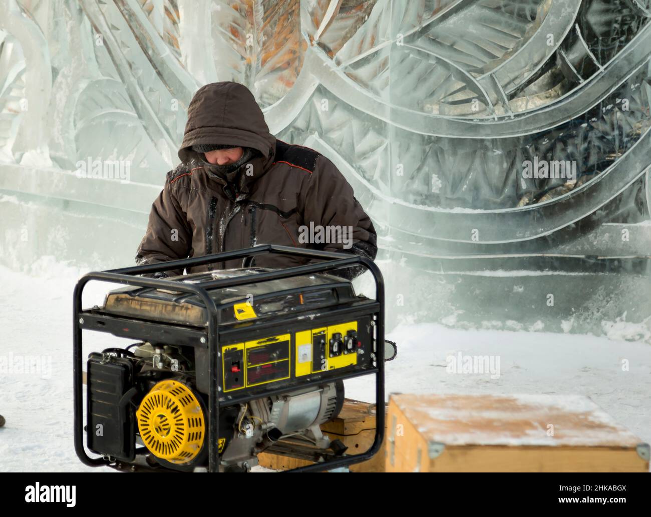 Working fitter at the construction site of the ice town near the gas ...