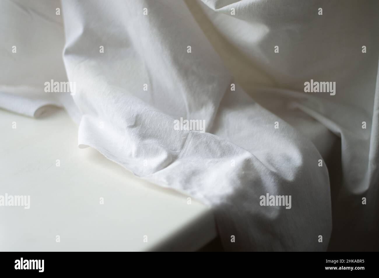 White linen abstract folded texture background Stock Photo - Alamy
