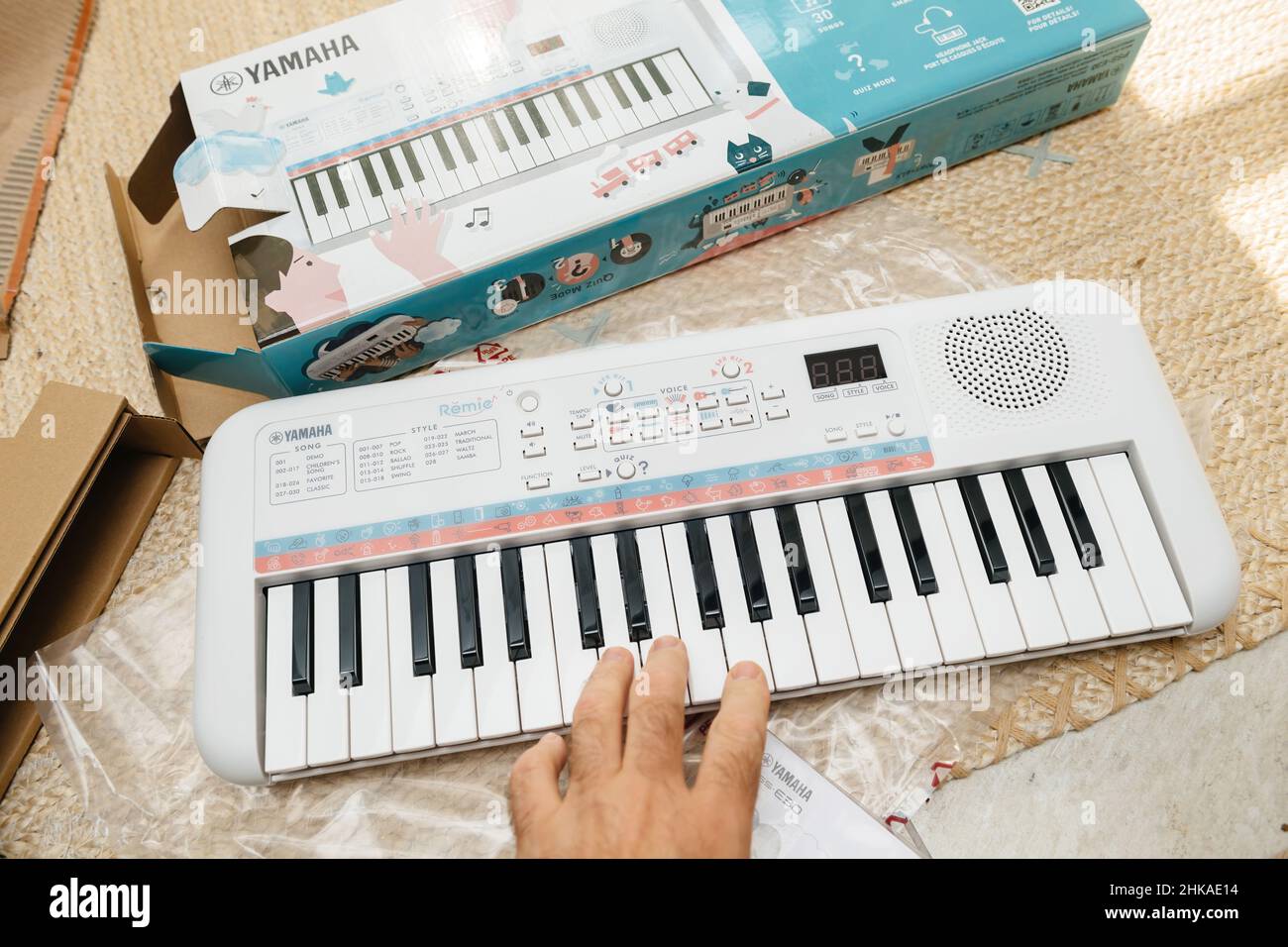 Paris, France - Sep 8, 2021: POV male hand playing after unboxing on new Yamaha Remie digital ...