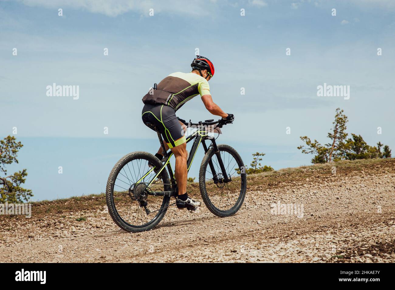 Man riding mountain bike uphill hi-res stock photography and images - Alamy