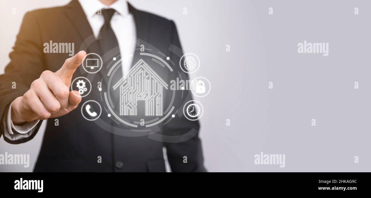 Businessman hold house icon.Smart home controlled, intelligent house ...