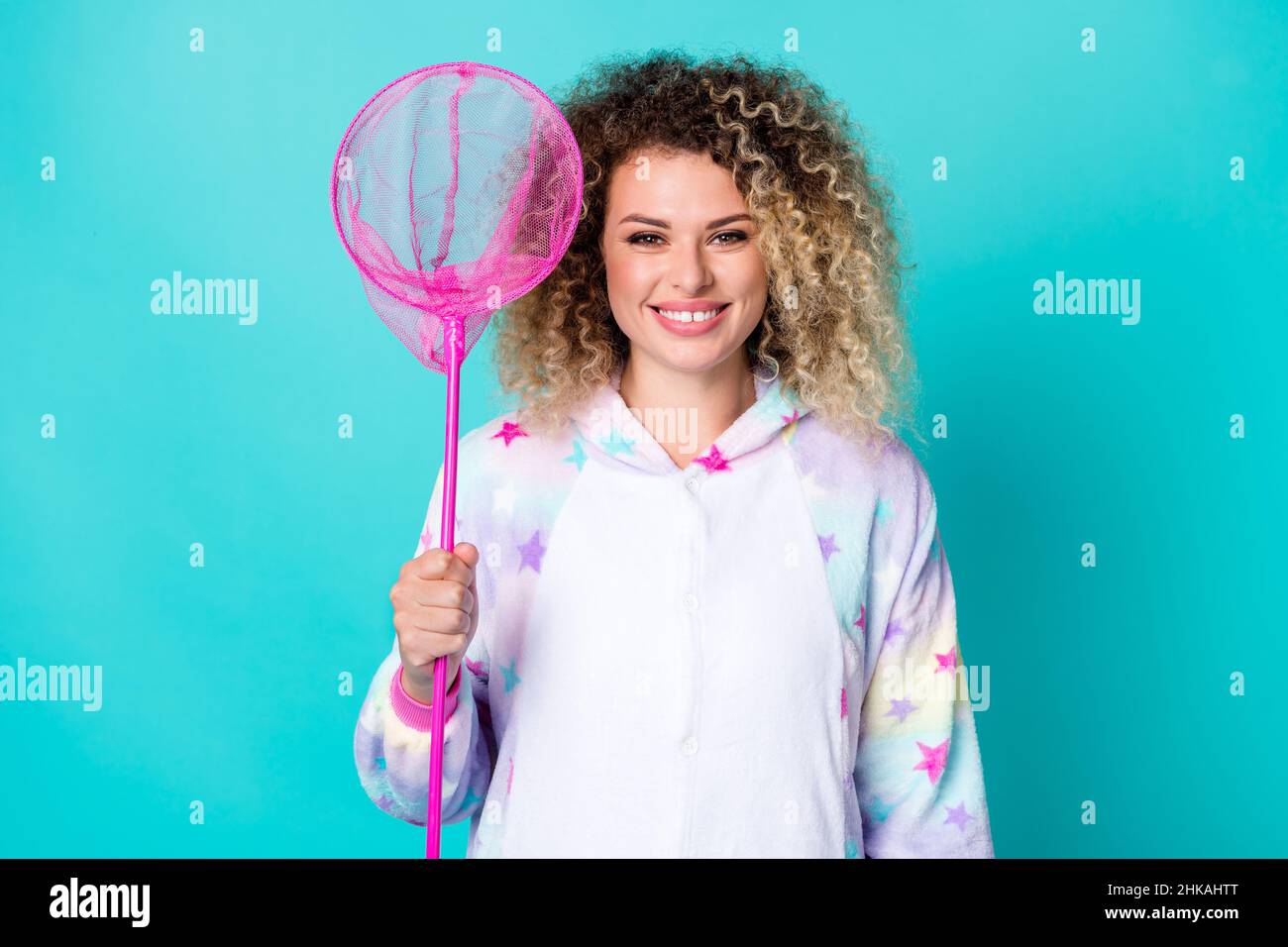 Portrait of attractive cheerful wavy-haired girl holding net isolated ...