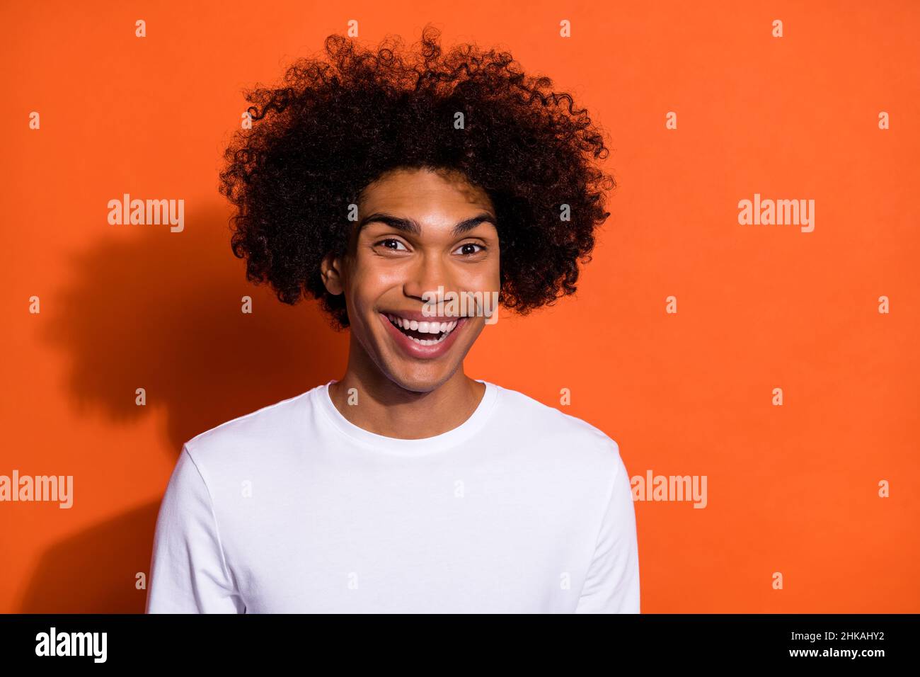 Photo of young cheerful man good mood comic humor laugh chevelure ...