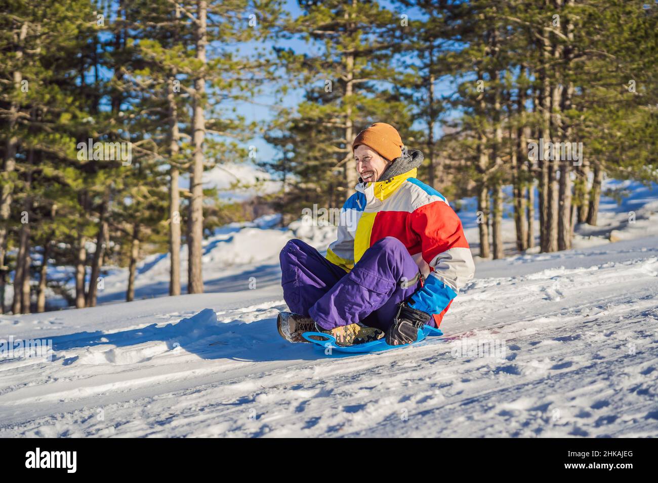 Adult man sliding down slide hi-res stock photography and images - Alamy