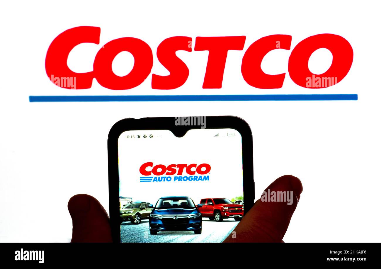In this photo illustration, the Costco Auto Program logo is displayed ...
