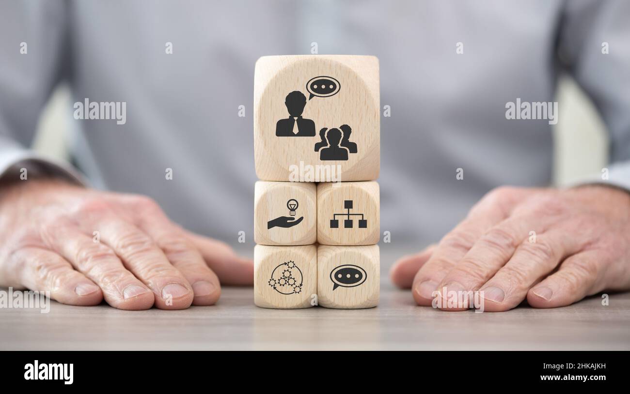 Wooden blocks with symbol of coaching concept Stock Photo - Alamy