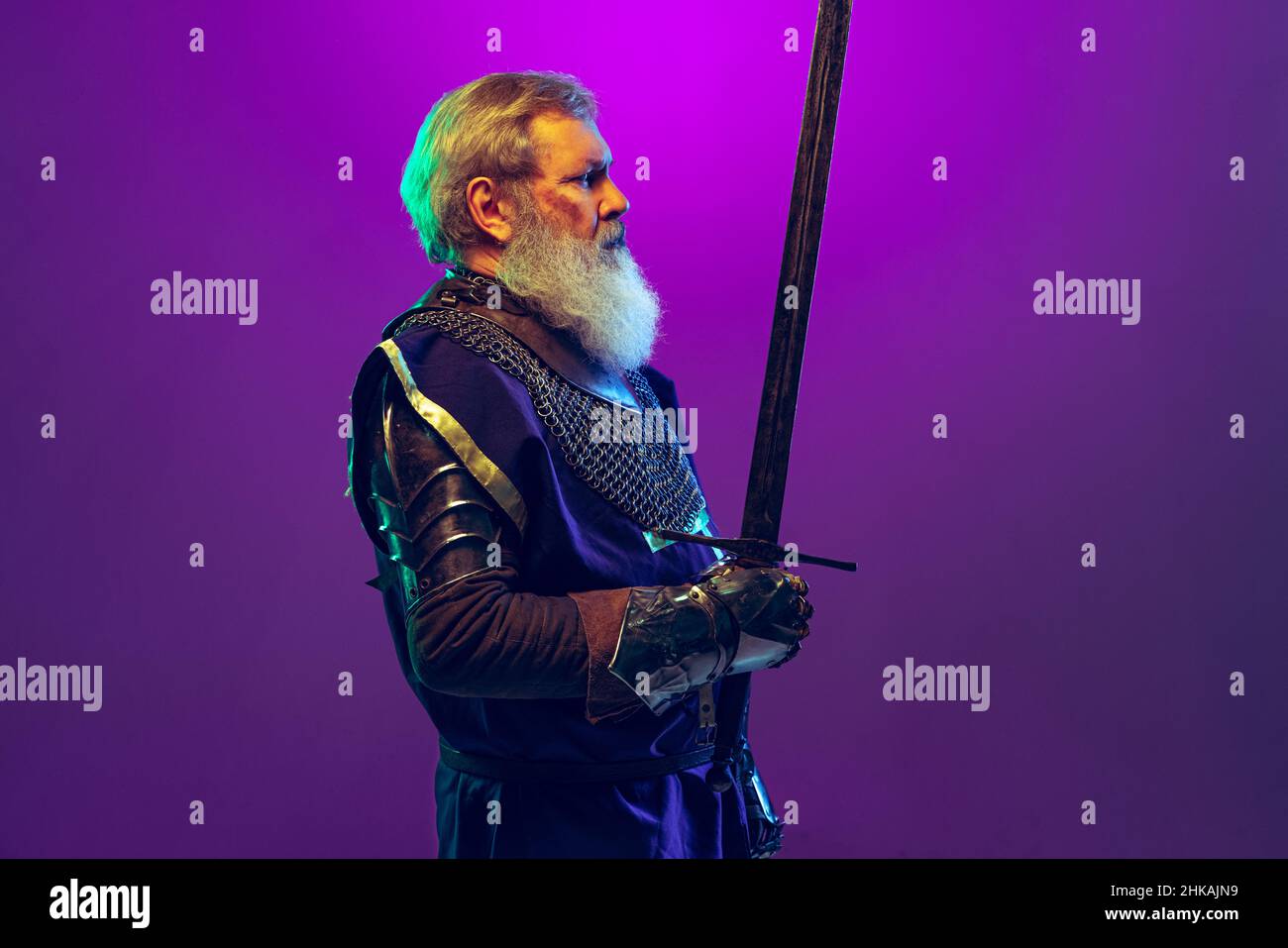 Profile view of senior greybearded man, brave and brutal medieval ...