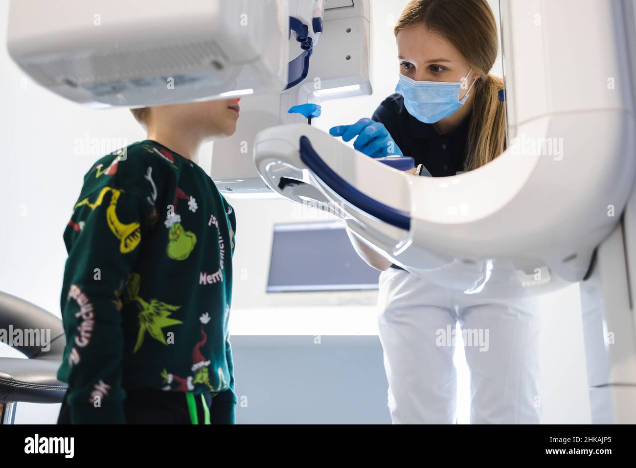 Radiographer taking panoramic teeth radiography to a little boy using modern x-ray machine Stock ...