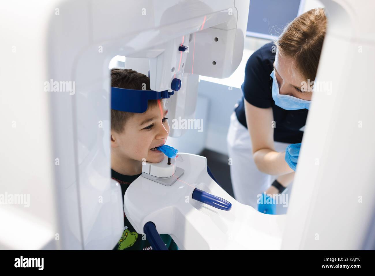 Radiographer taking panoramic teeth radiography to a little boy using modern x-ray machine Stock ...