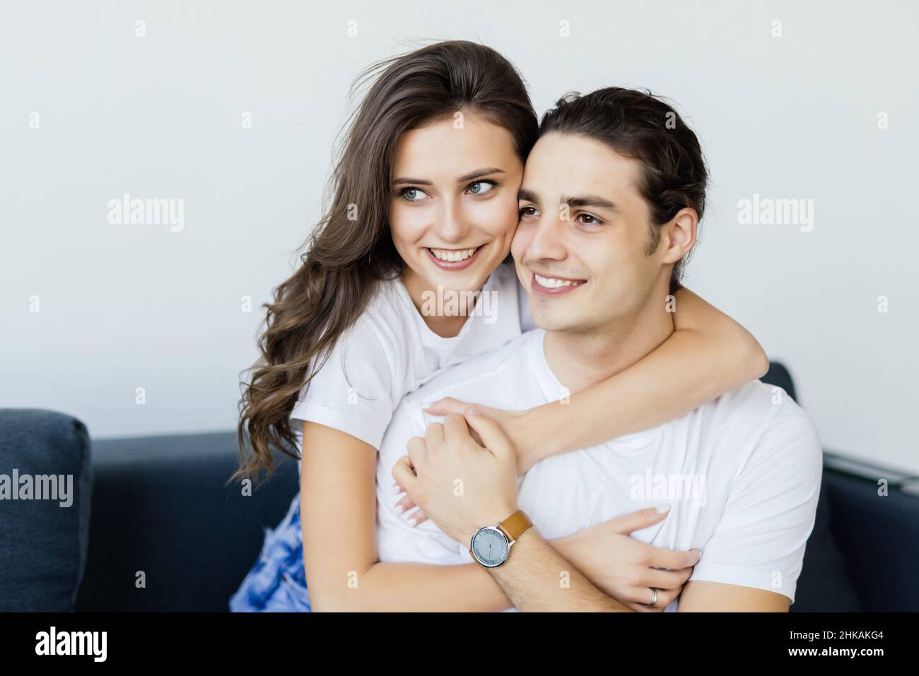 Beautiful couple, holding hands, posing for camera Stock Photo - Alamy