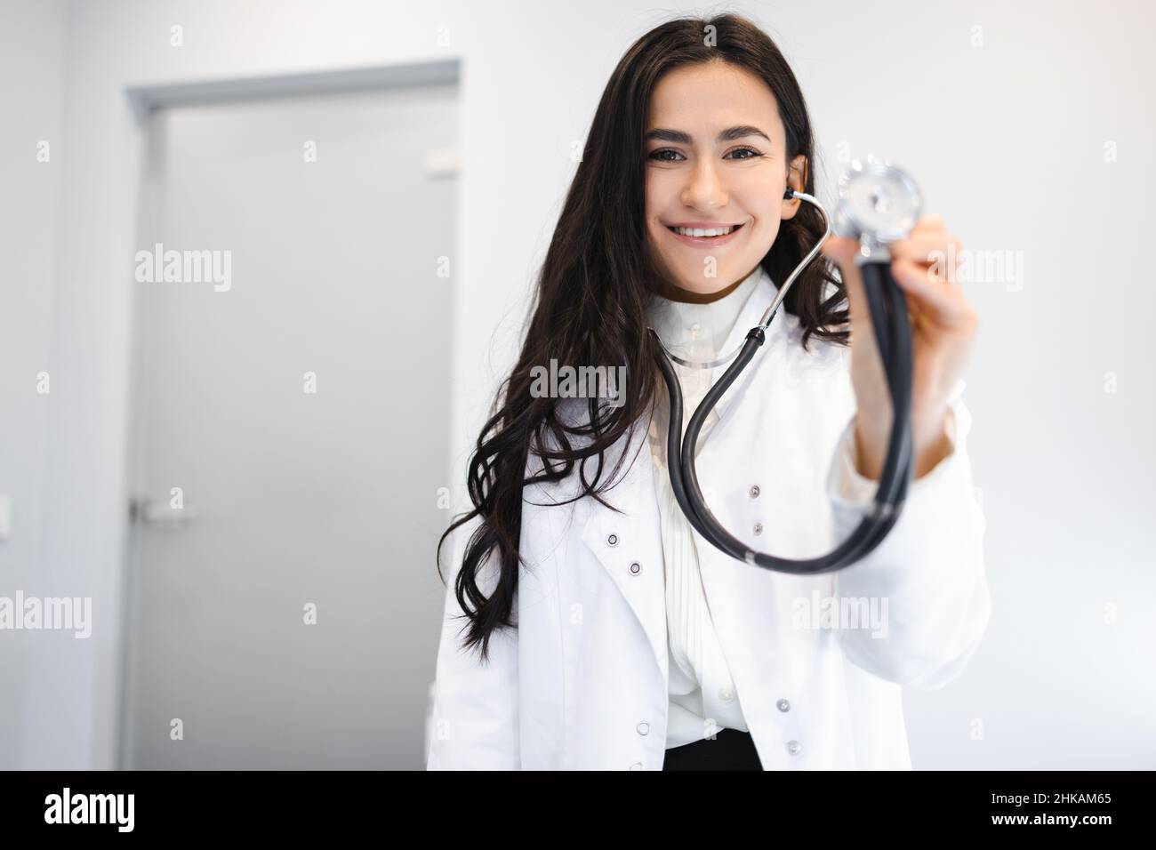 Pretty nurse listening stethoscope hi-res stock photography and images ...