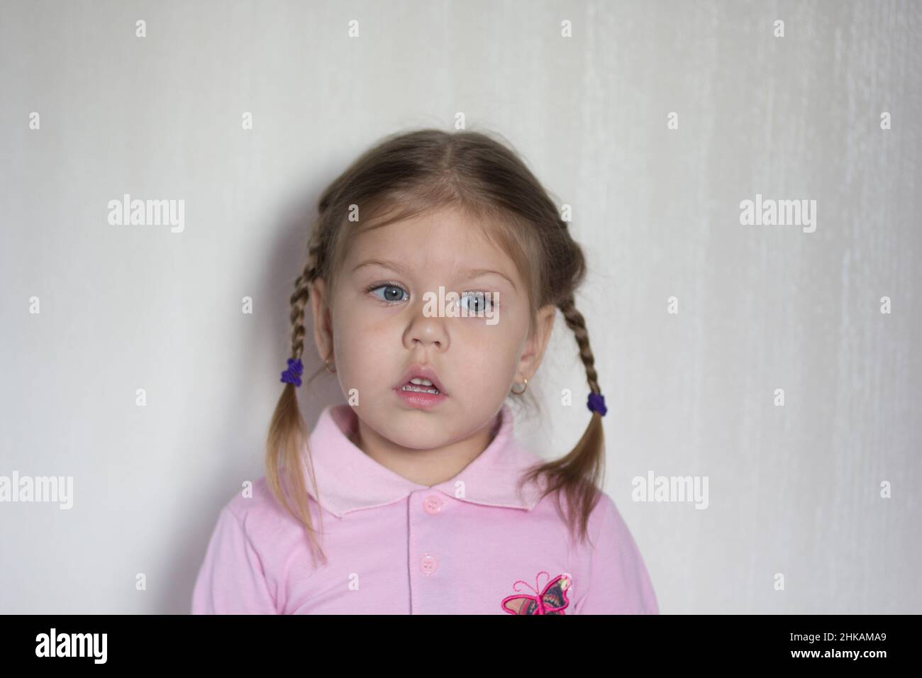 Portrait of caucasian of three age calm child without emotions looking ...