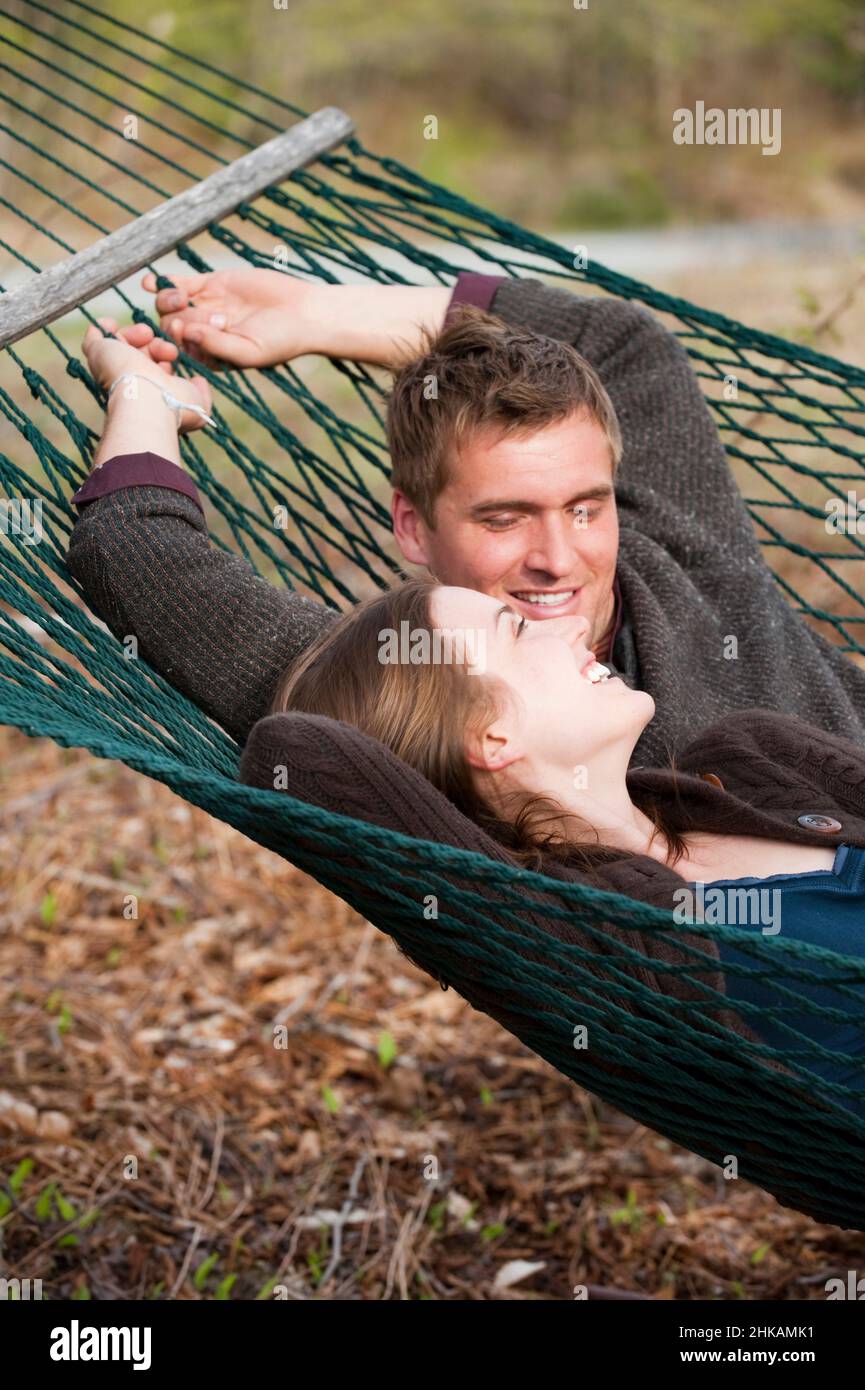 Young couple laying in hammock Stock Photo - Alamy