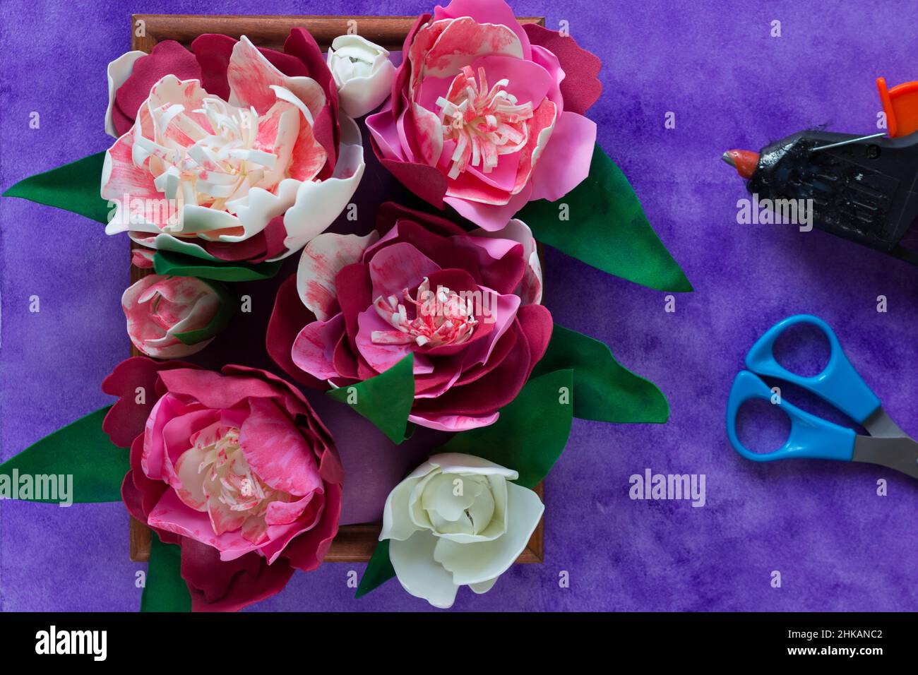 Handmade decorative peonies made from foamiran on wooden panel and glue ...