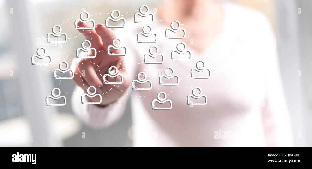 Woman touching a social network concept on a touch screen with her ...