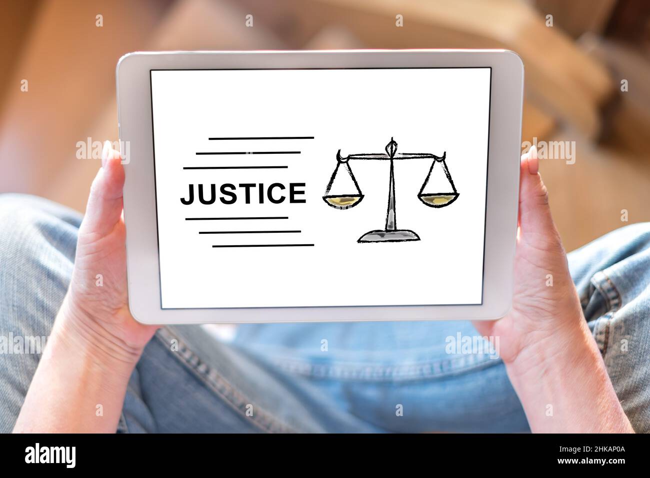 Tablet screen displaying a justice concept Stock Photo - Alamy