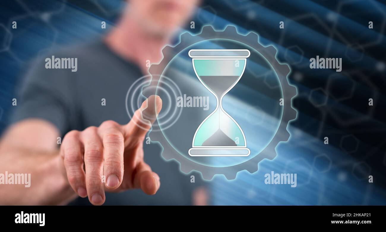 Man touching a time management concept on a touch screen with his ...