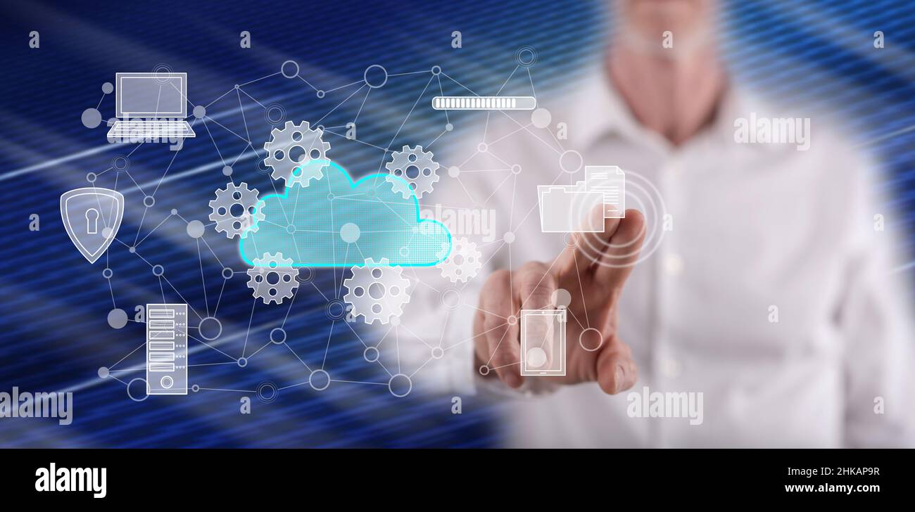 Man touching a cloud computing concept on a touch screen with his ...