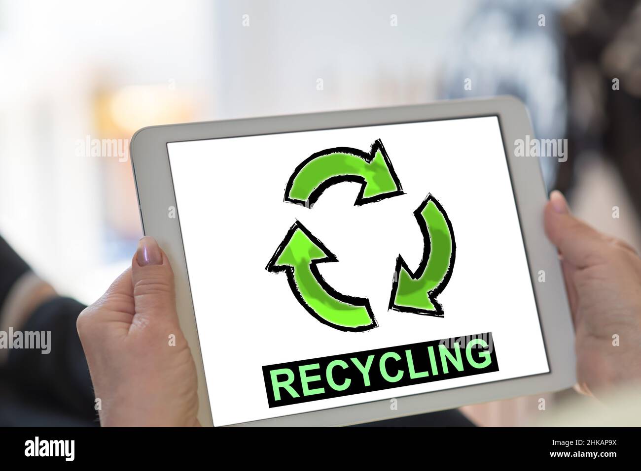 Tablet screen displaying a recycling concept Stock Photo - Alamy