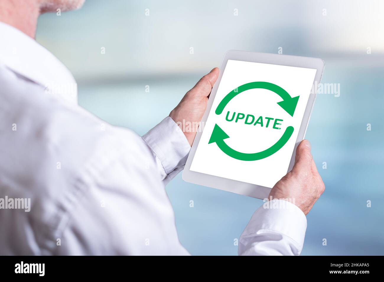 Tablet screen displaying an update concept Stock Photo - Alamy