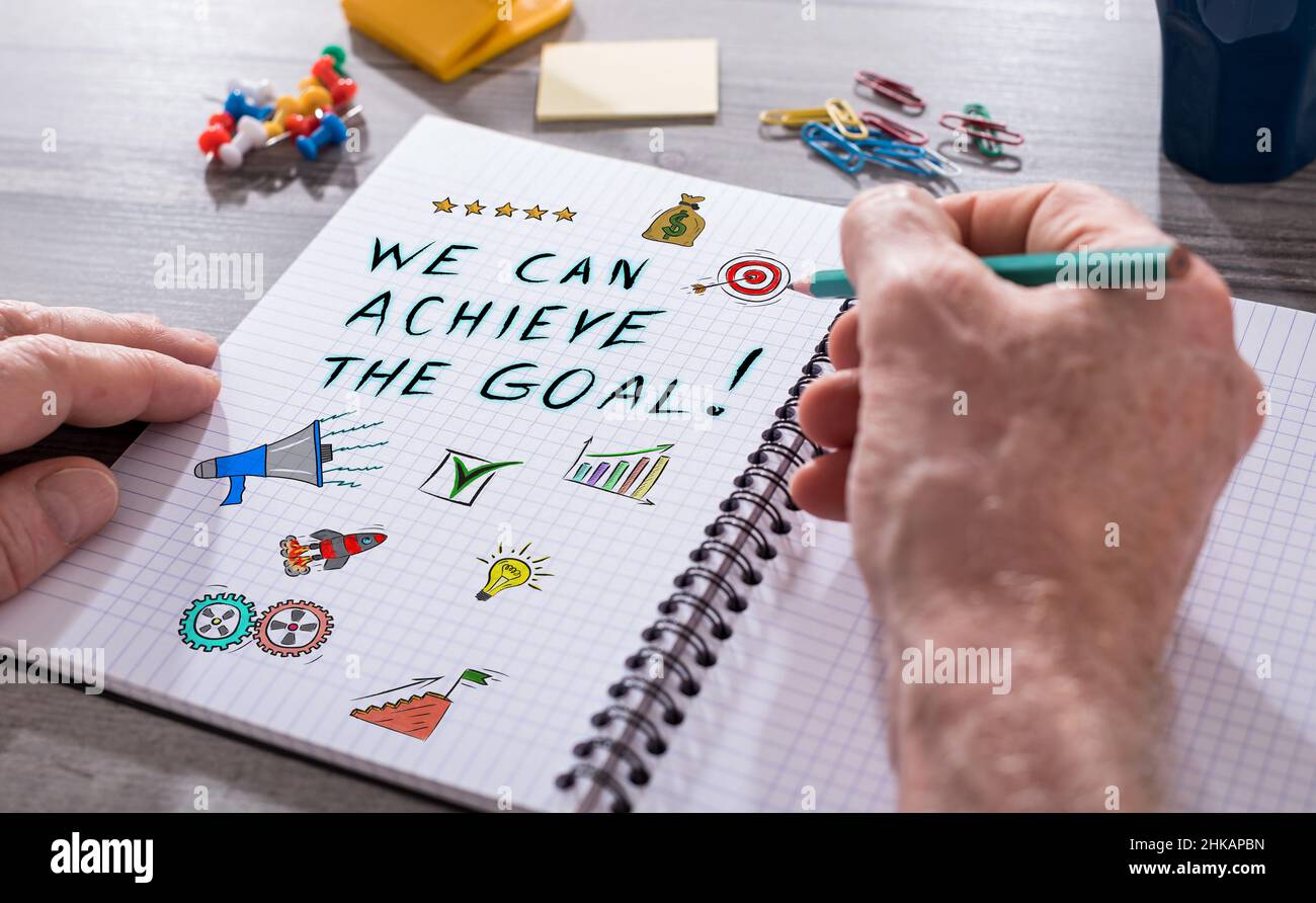 Hand drawing goal achievement concept on a notepad Stock Photo - Alamy
