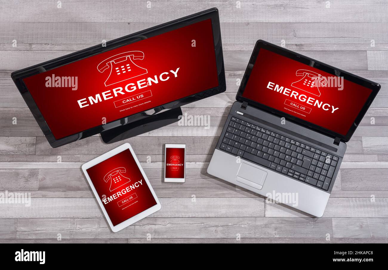 Emergency concept shown on different information technology devices ...