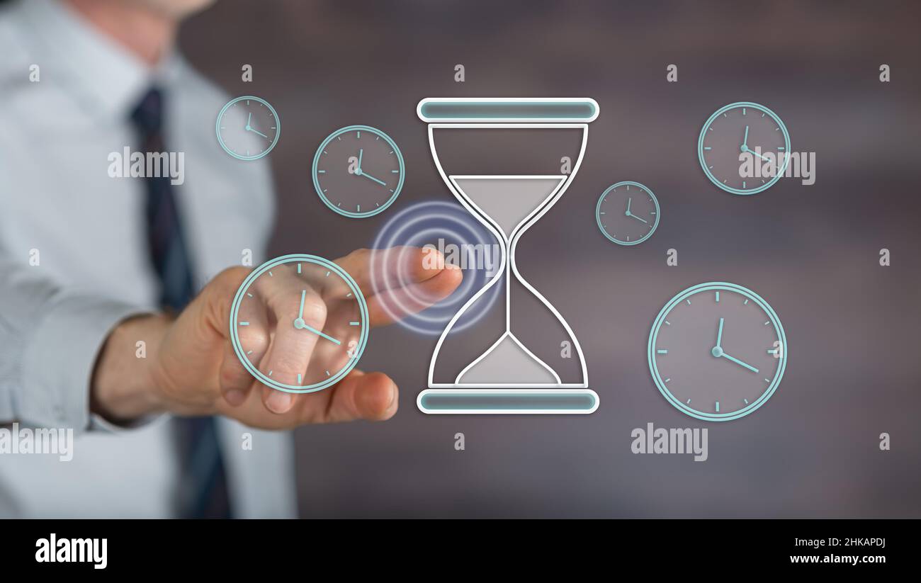 Man touching a time management concept on a touch screen with his ...