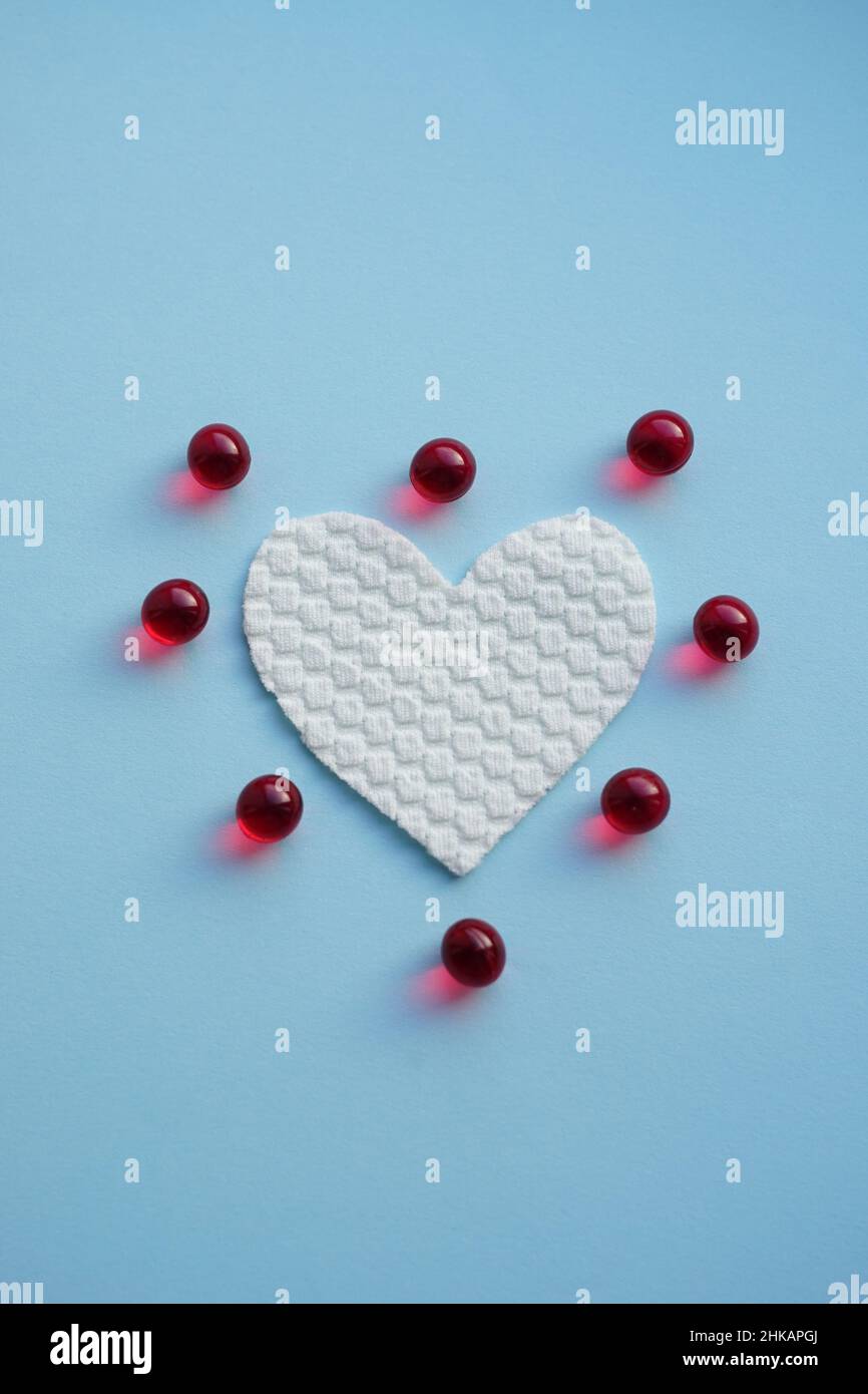 Red heart on pale blue hi-res stock photography and images - Alamy
