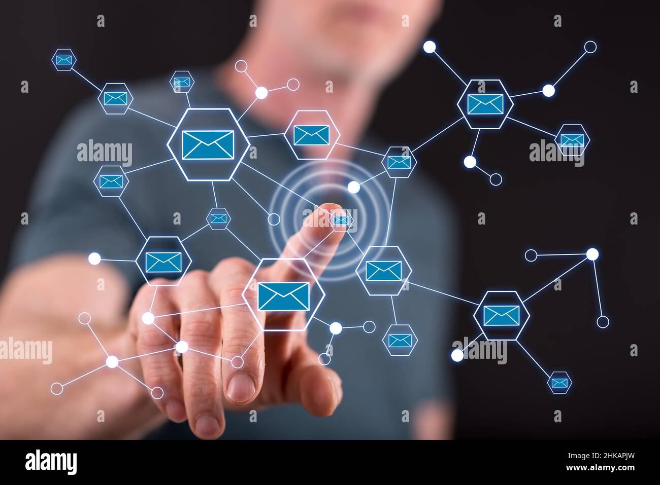 Man touching an email on a touch screen with his finger Stock Photo - Alamy