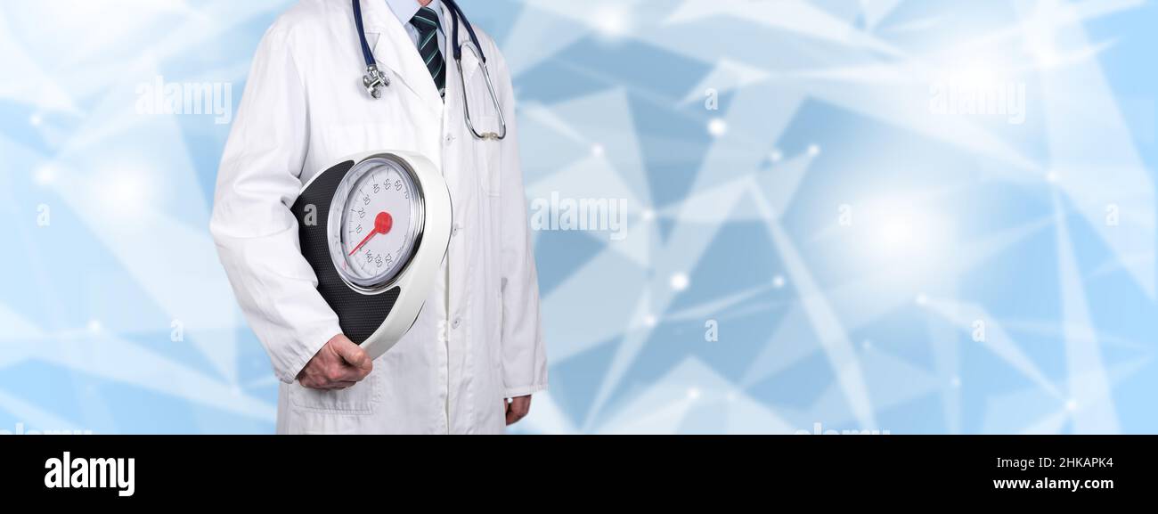 Doctor holding weight scale hi-res stock photography and images - Alamy