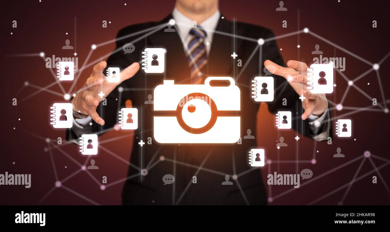 Hand holding social media icons Stock Photo - Alamy