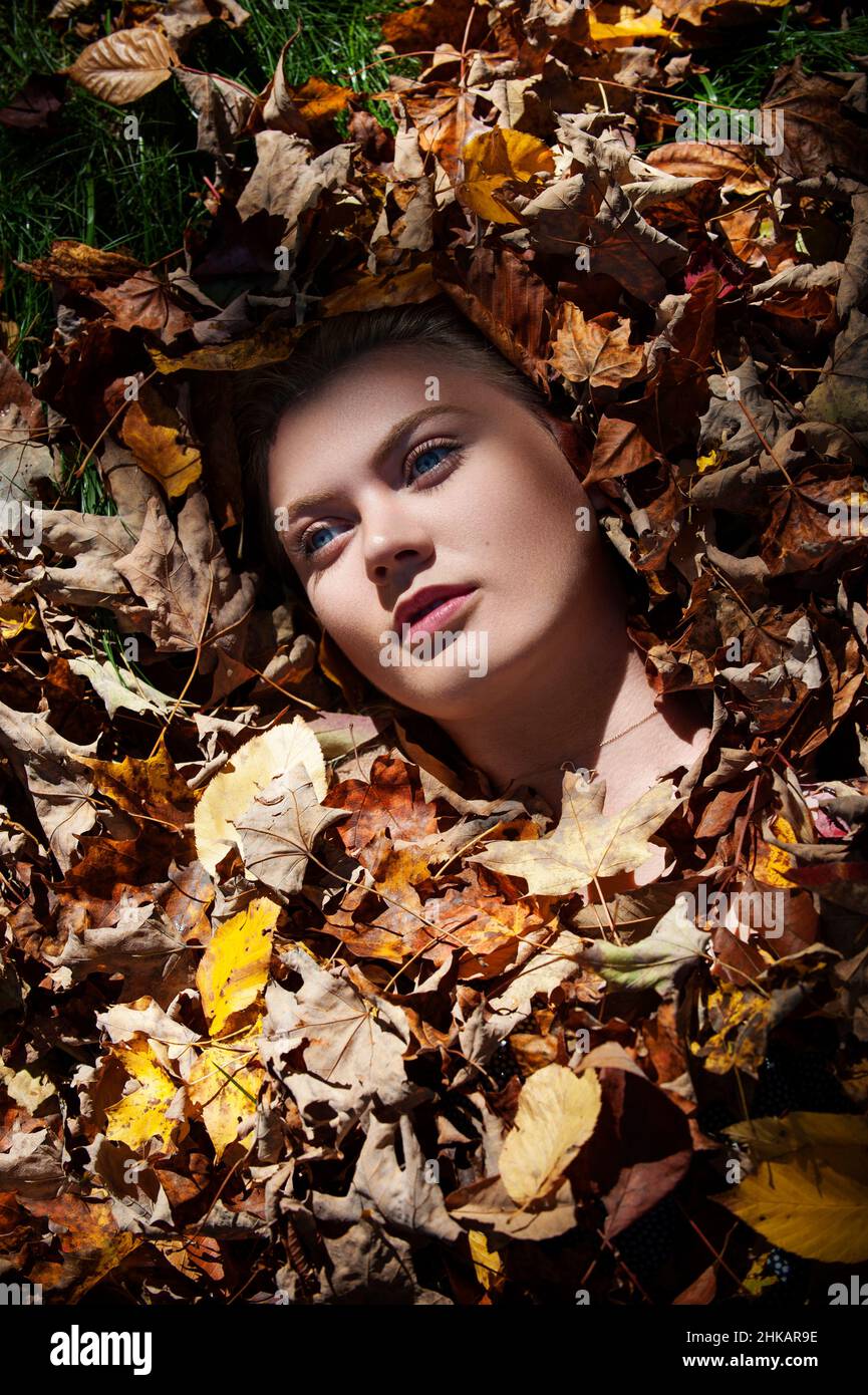 Girl laying on the ground hi-res stock photography and images - Alamy